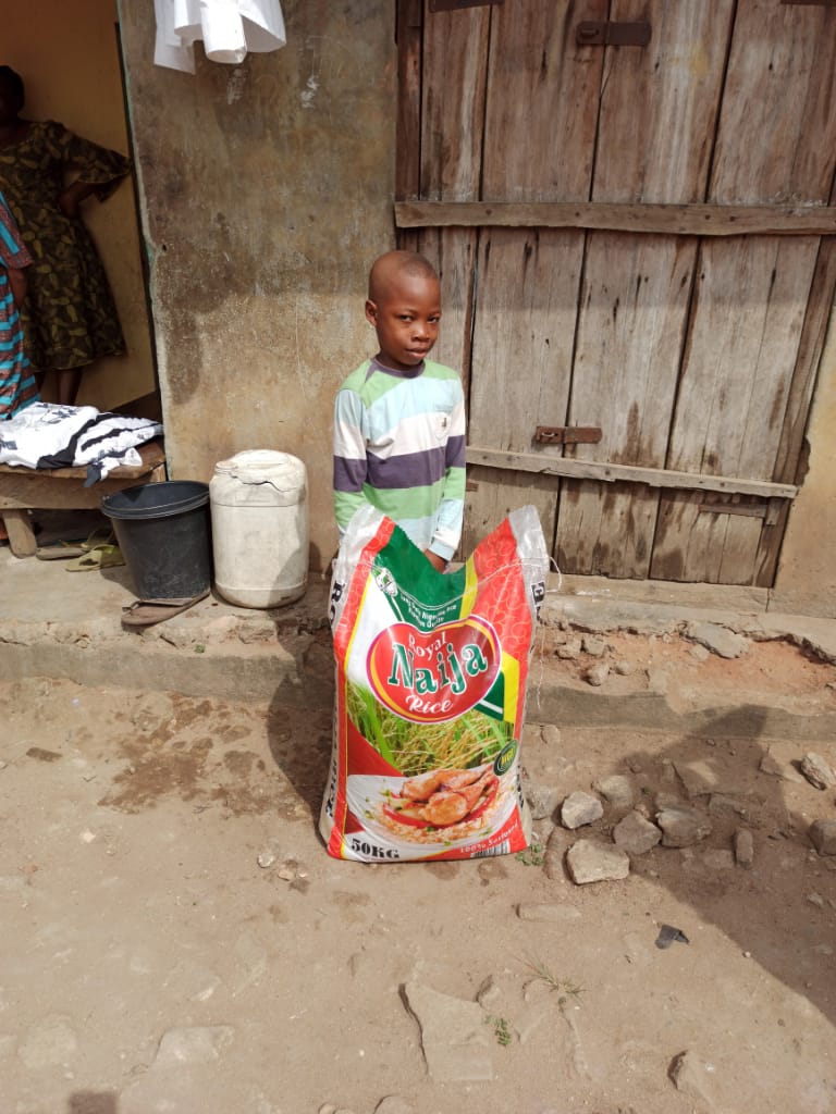 Bag of Rice Project #46 -A visit to the John Family - A Thrifty Mom